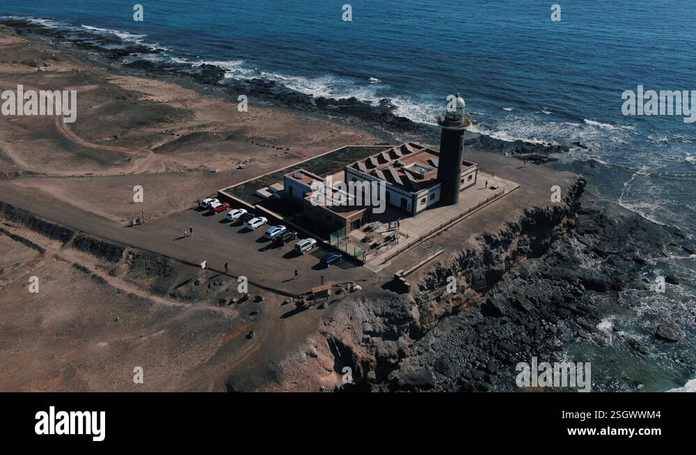Fantastic aerial shot in fast orbit over the Jandia lighthouse on the ...