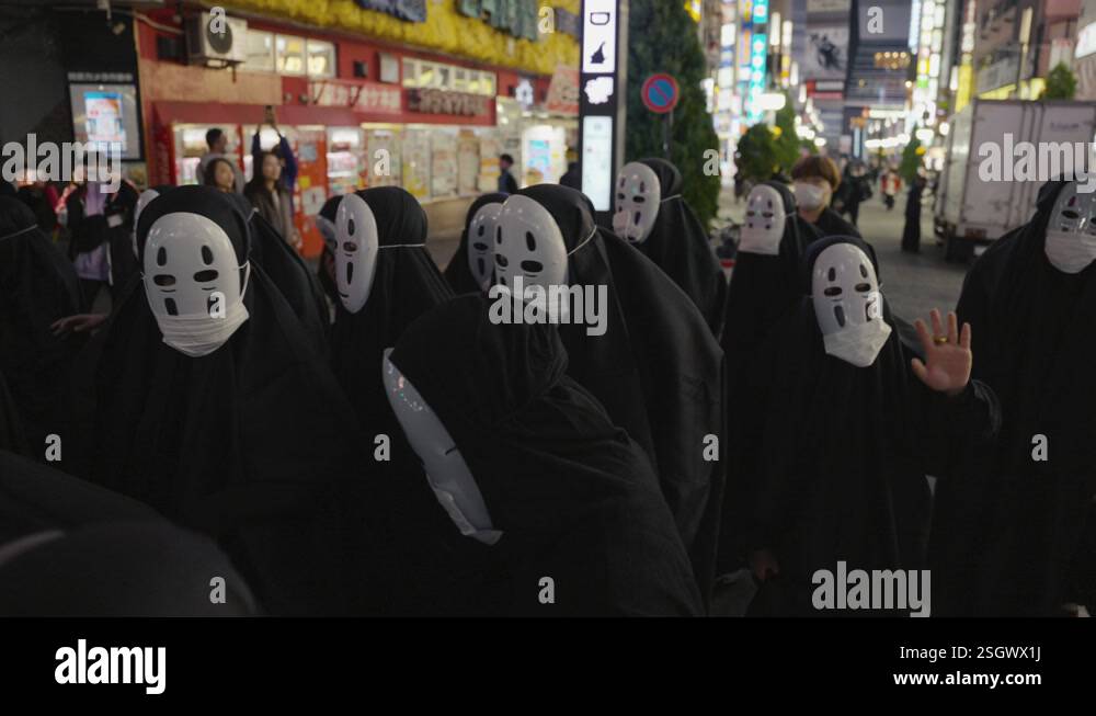 Crowd of Halloween Goers Dressed as "No-Face" Character in Shinjuku ...
