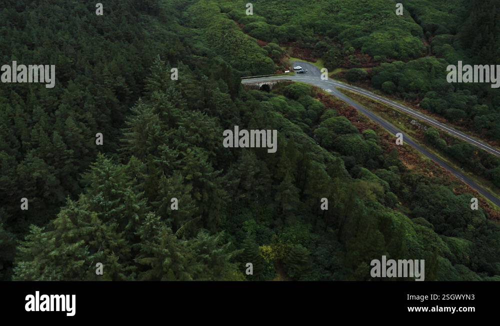 Ancient bridge with a v-shaped turn on the road leading to a gap in the ...