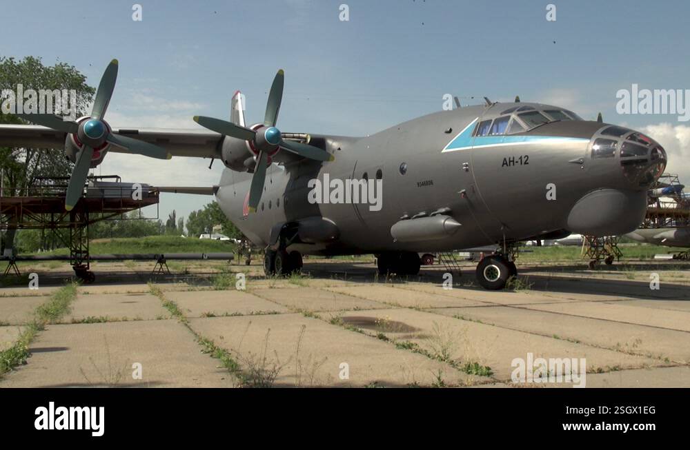 Military transport aircraft Antonov An-12BK (NATO codification Cube) on parking Stock Video ...