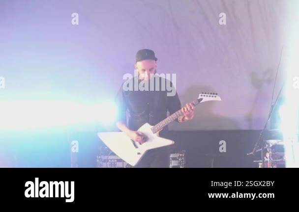 Singer close-up on stage sings emotionally. Pastor, preacher, sect ...