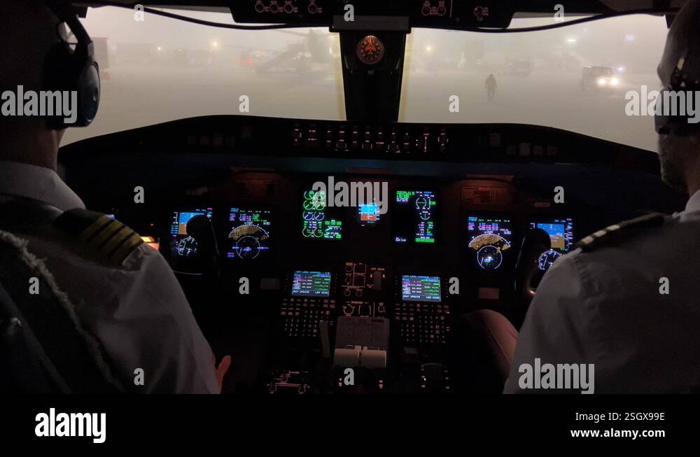 Jet cockpit view inside in a heavy fog codition in the airport ramp at ...