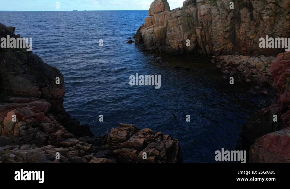Red rocks by the sea Stock Video Footage - Alamy