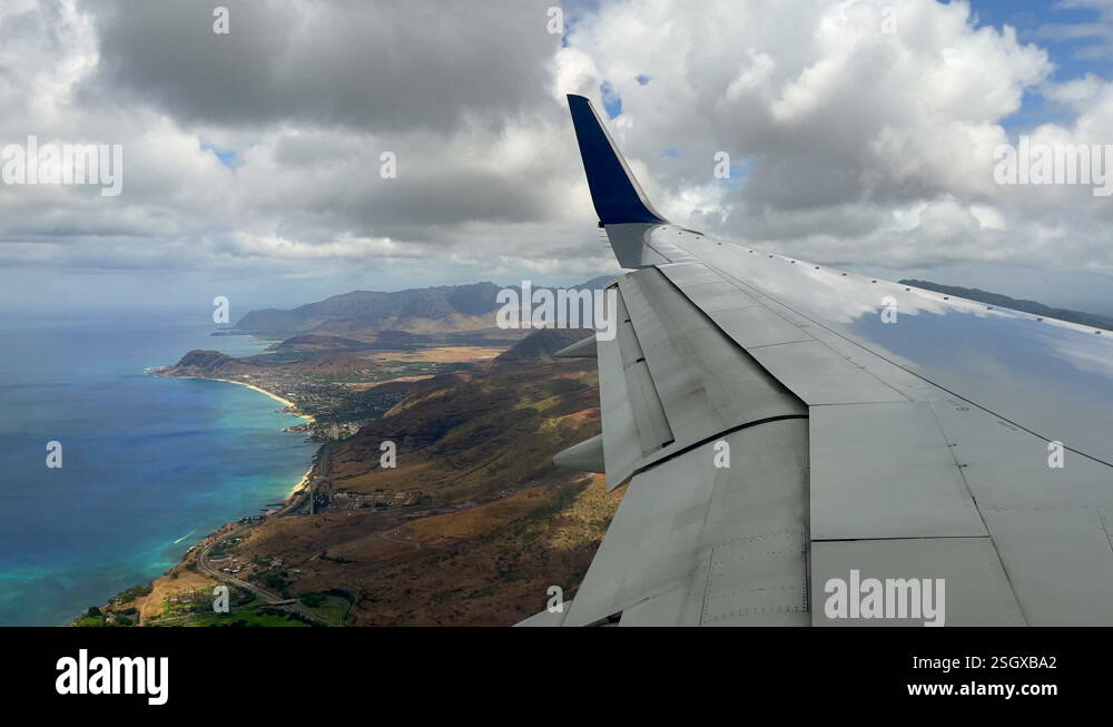 View from an airplane window of the wing and the landing to Hawaii big ...