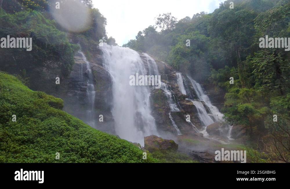 Dynamic view of stunning waterfall in lush jungle with water hitting ...