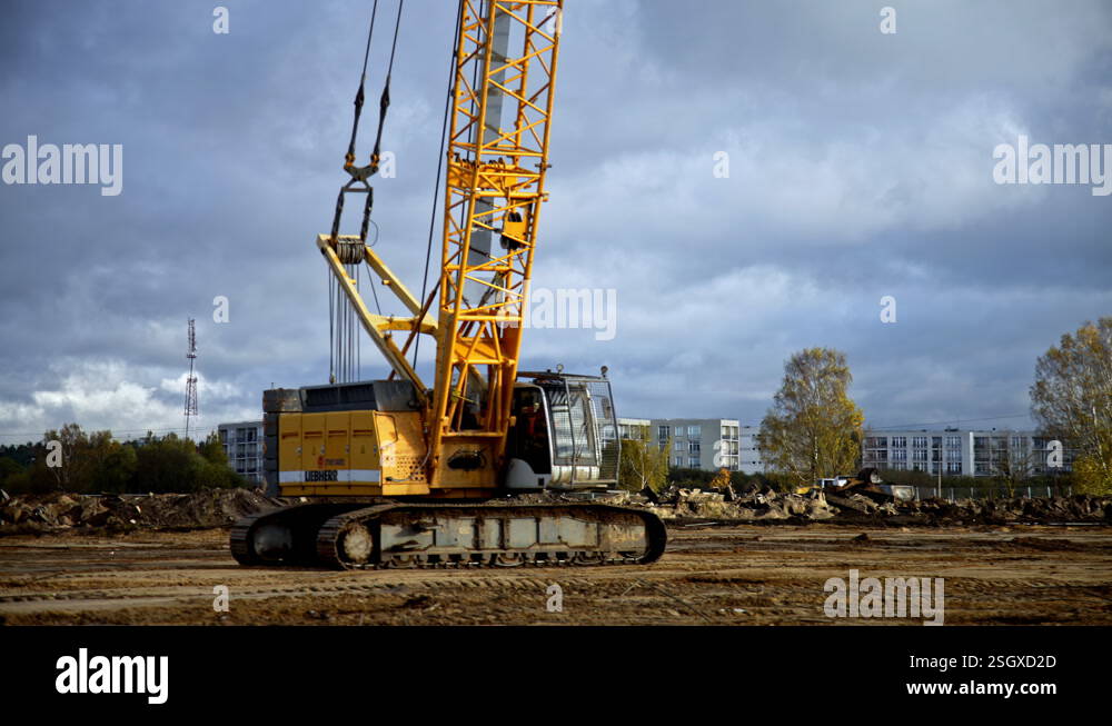 Crane on crawler dropping heavy weight. Demolition site and equipment ...