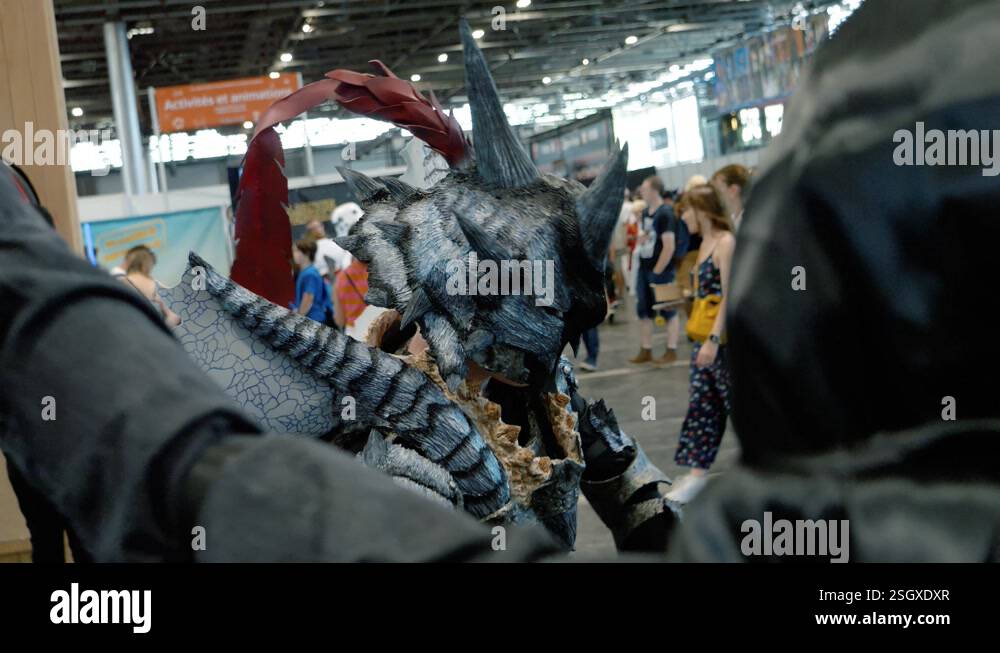 Person dressed up as fiction warrior slicing his sword at cosplay event ...