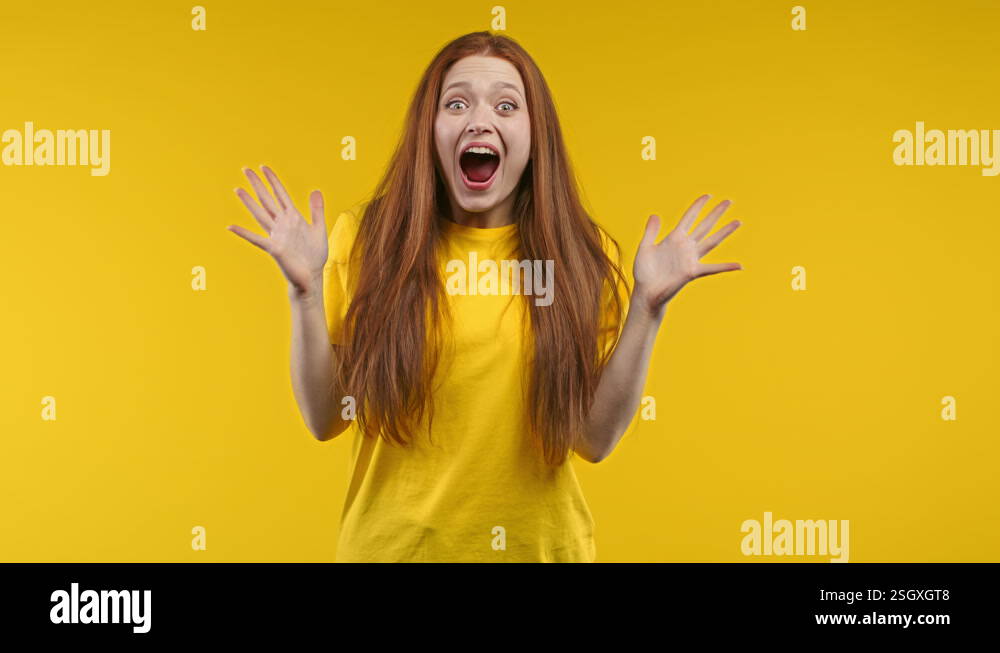 Shocked woman with ginger hair very glad, she screaming loud WOW. Lady ...