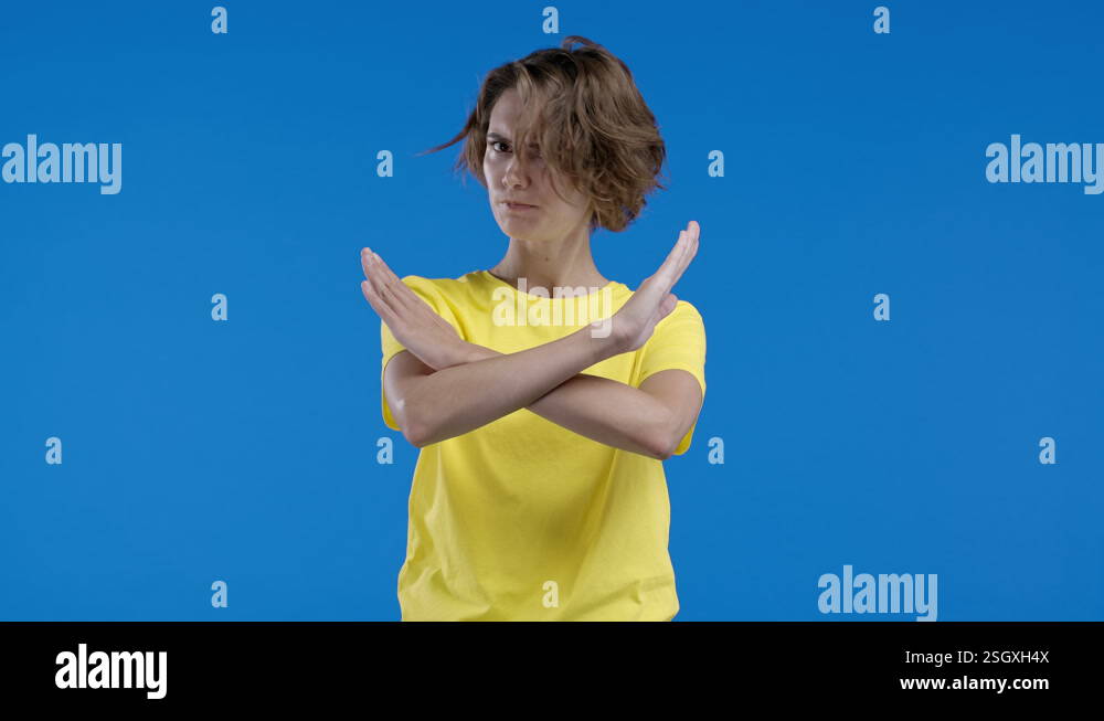 Nervous woman disapproving with NO hand sign gesture. Denying ...