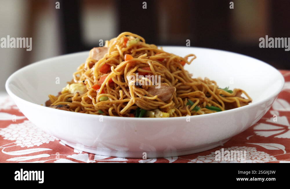 Rotating Bowl of Mee Goreng Stock Video Footage - Alamy
