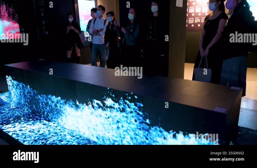 Chinese visitors look at a digital art installation at the Digital Art Stock Video Footage - Alamy