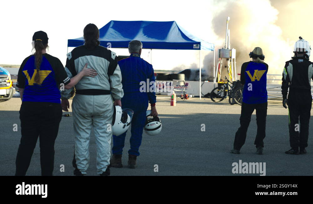 People watching race car burning after big explosion Stock Video ...
