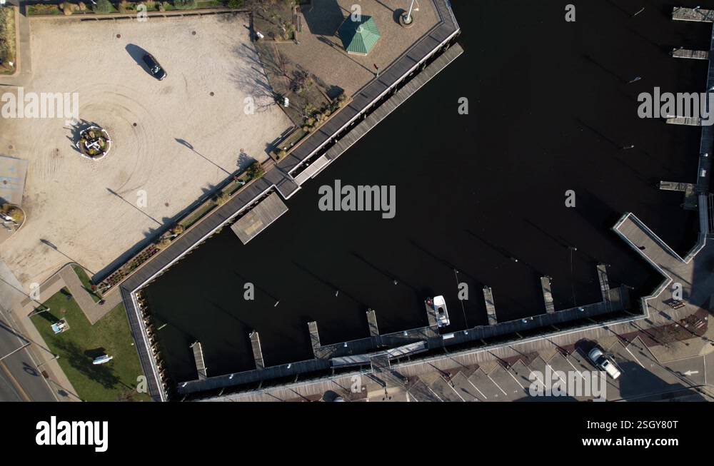 A top down view directly above a park with gravel and a boardwalk on ...