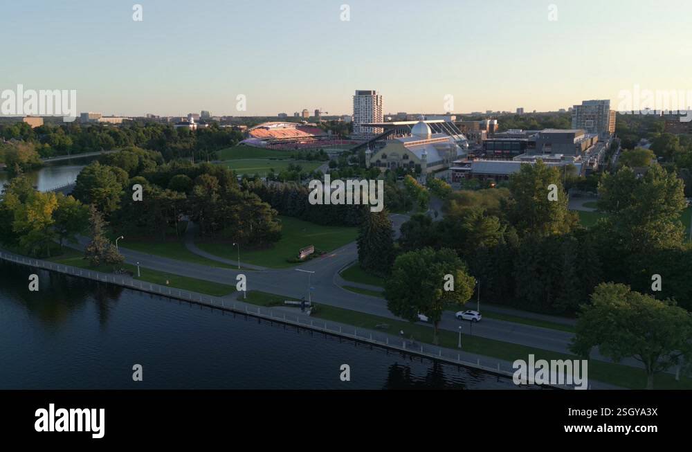 Sunset aerial shot of Lansdowne Park in Ottawa Ontario. Crane up over ...