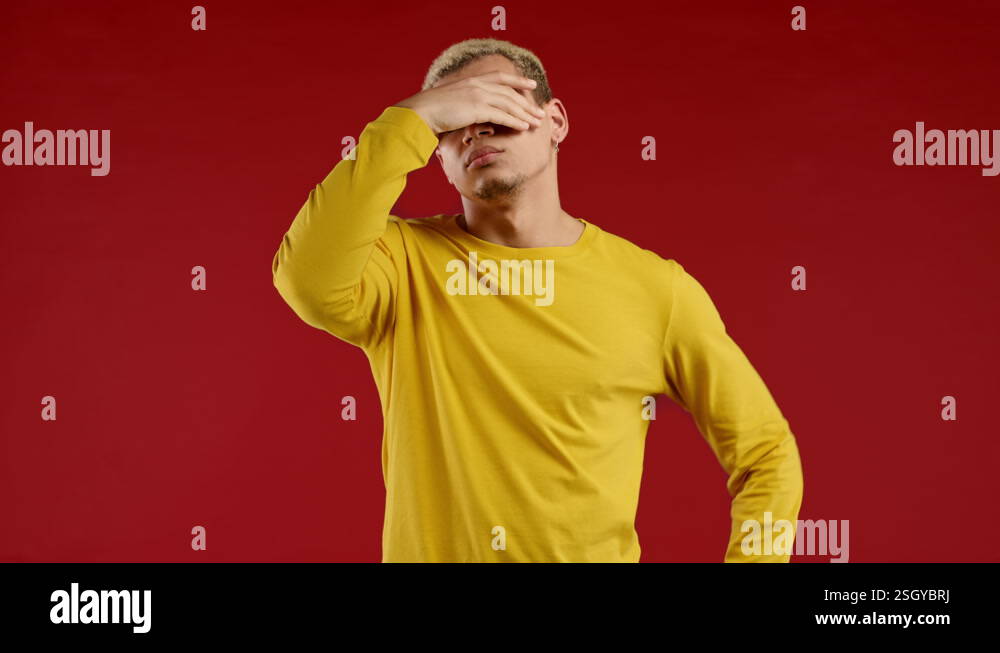 Worried man doing face-palm gesture, like no, I forgot. Disappointed ...