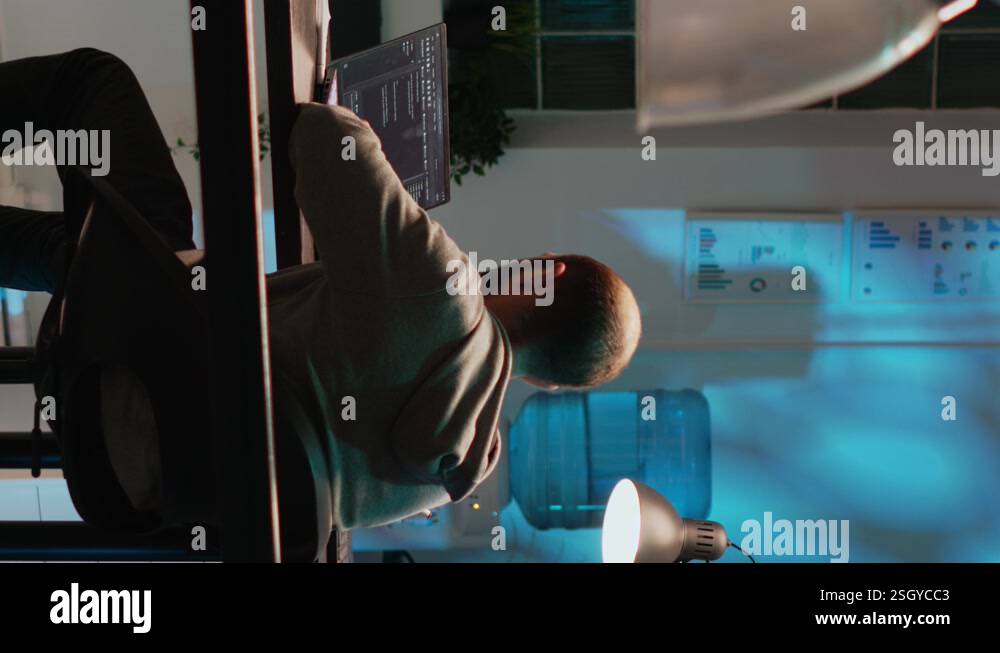 Vertical video: Pleased app developer programming source code and celebrating Stock Video ...