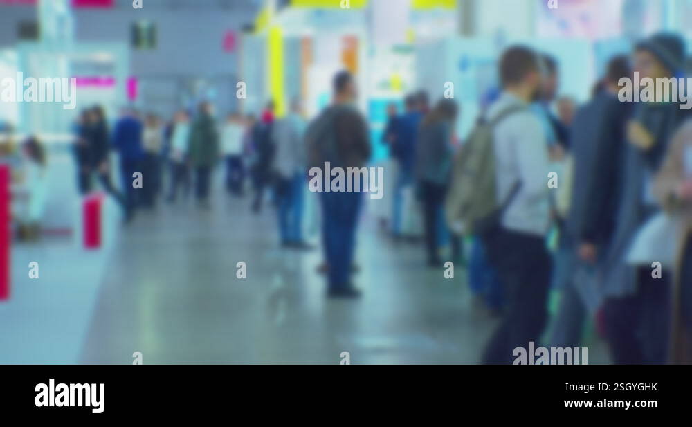 time lapse.unrecognizable people moving fast inside a large building ...
