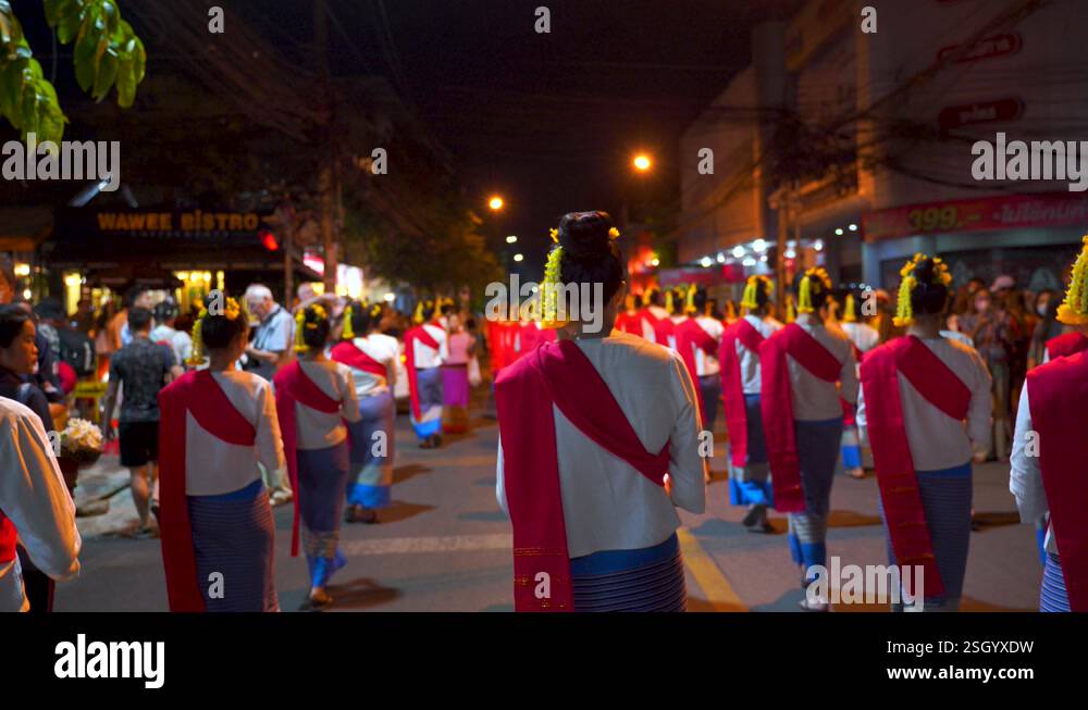 POV walking with women during traditional Yi Peng Parade in Thailand ...