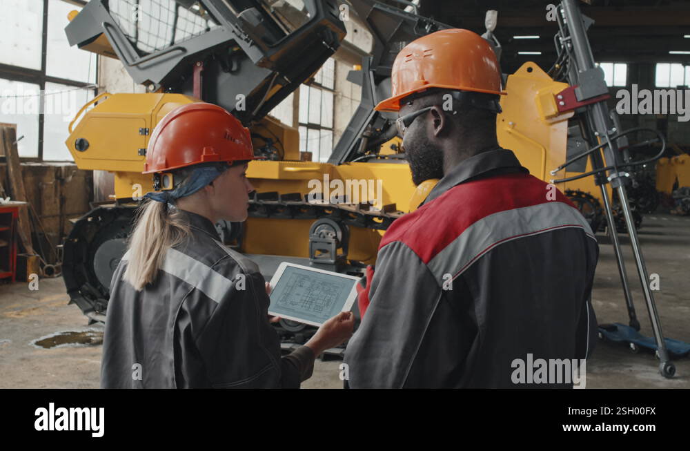 Engineers Discussing Tractor Machine Schemes at Plant Stock Video ...