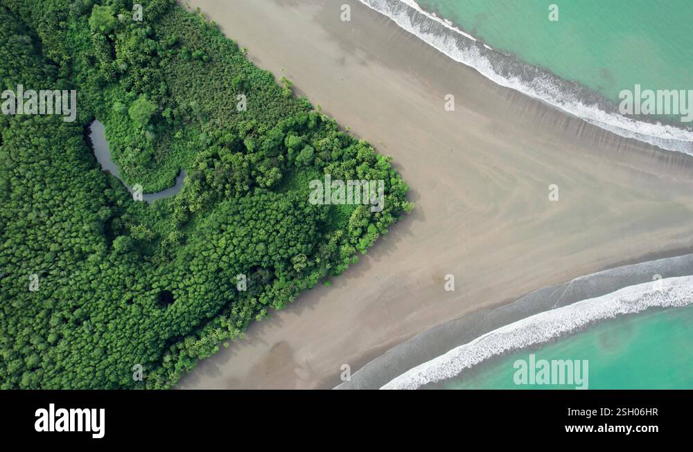 Triangular rainforest on narrowing tropical beach in Uvita, Costa Rica ...