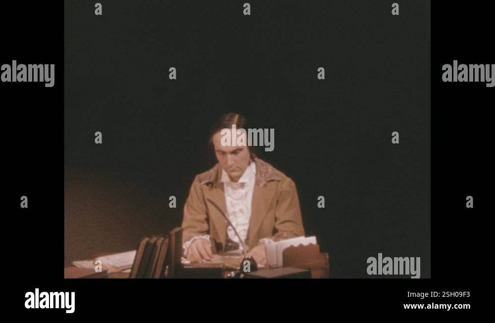 1950s: Clean-shaven Colonial man in short tail coat and cravat speaks ...