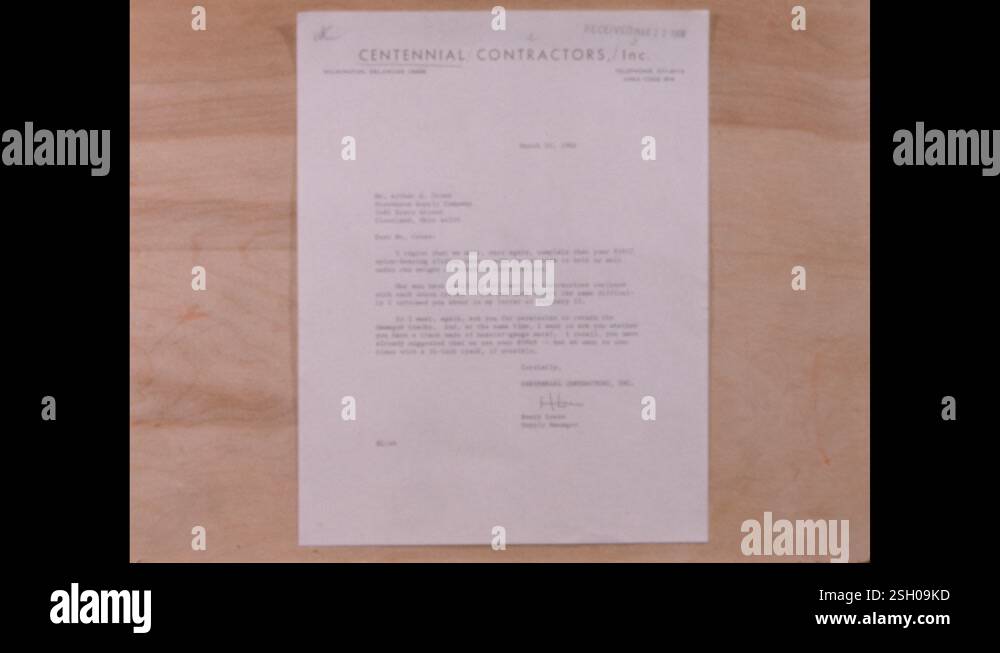 1960s: Contract paperwork lies on tabletop. Hand displays marked up ...