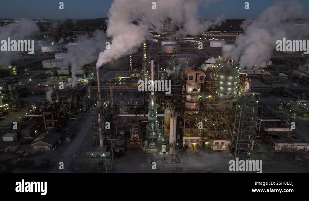 American oil refinery at daybreak in Tulsa Oklahoma. Rising aerial ...