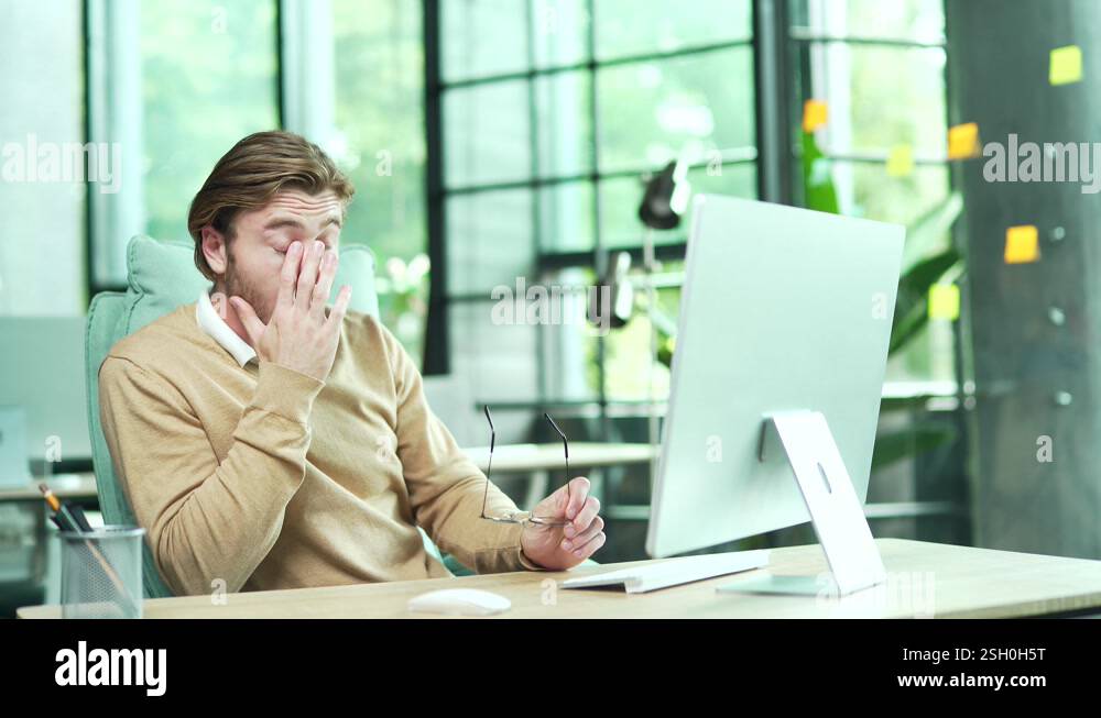 Tired overworked entrepreneur business man employee with eyes hurt ...