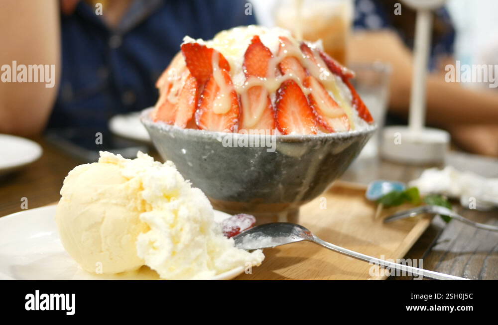 Bingsu - Korean shaved ice dessert with sweet toppings with strawberry ...