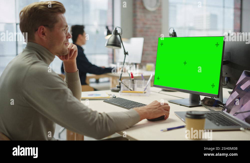 Man Working on Computer with Green Screen in Office Stock Video Footage ...