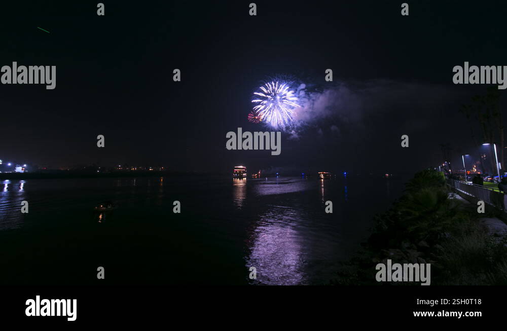 Lockdown Time Lapse Shot Of People Enjoying Fireworks At Harbor - Los ...