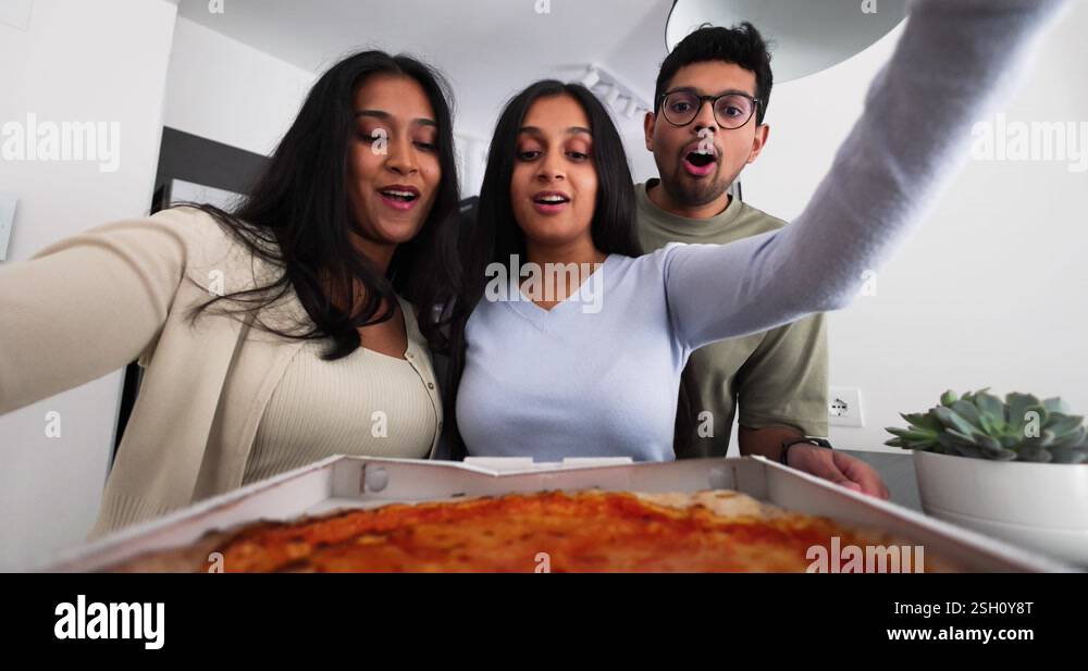 Hungry friends opening pizza box Stock Video Footage - Alamy