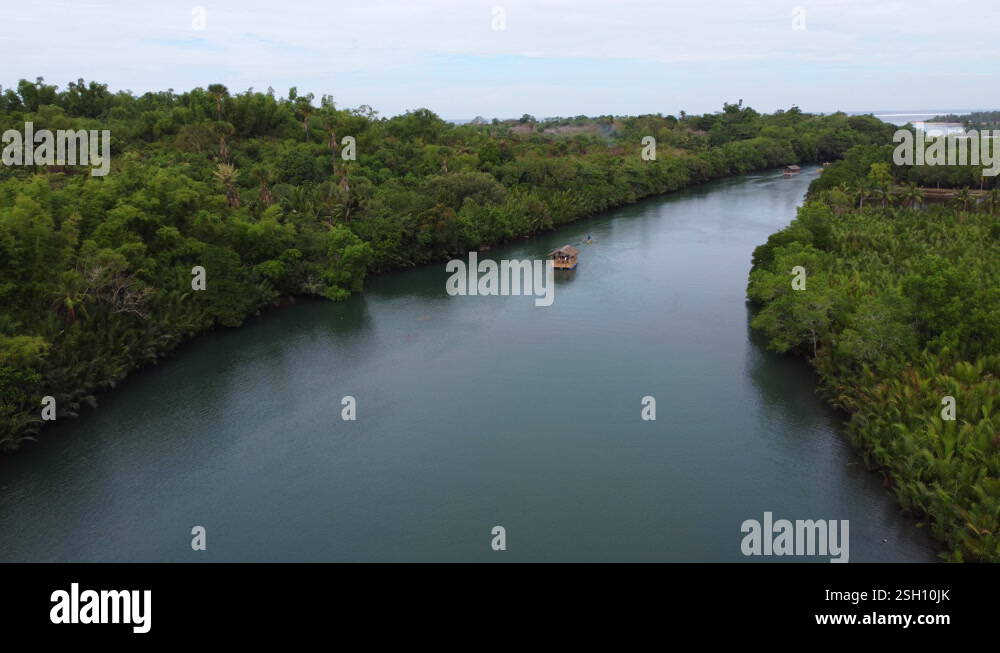Drone view of floating restaurant on tropical river in Bolinao ...