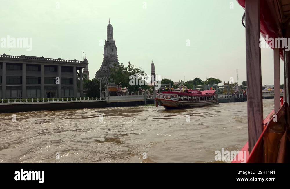 A boat ride on the Chao Phraya River. You can see the Wat Arun Temple ...