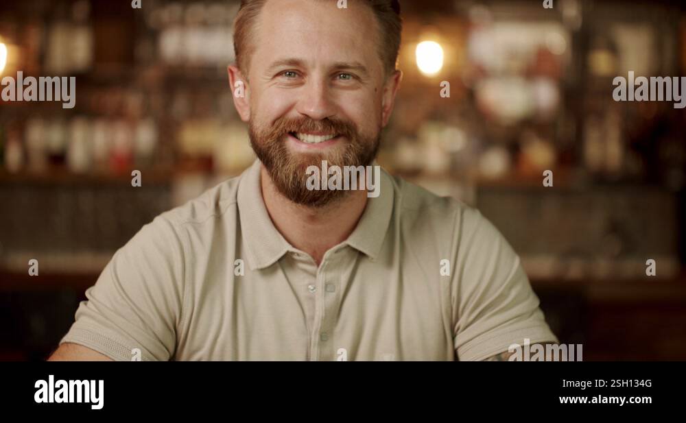 Cheerful bartender smiling for camera Stock Video Footage - Alamy
