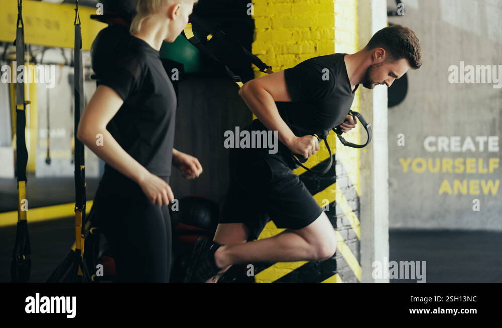 Female fitness coach explaining man how to do sprinter start exercise ...
