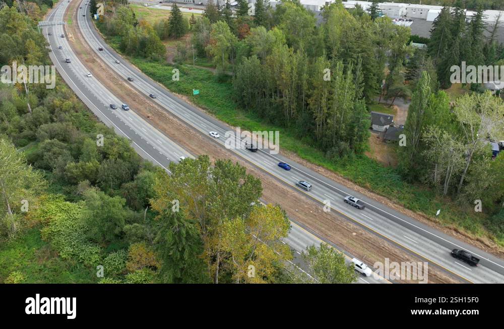 Aerial view of cars quickly zipping down the freeway Stock Video ...