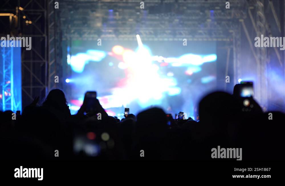Famous singer Dua Lipa gives a concert in an open stage, exited fans ...