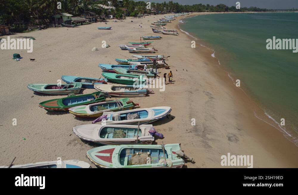drone flight over boats in the sand Stock Video Footage - Alamy