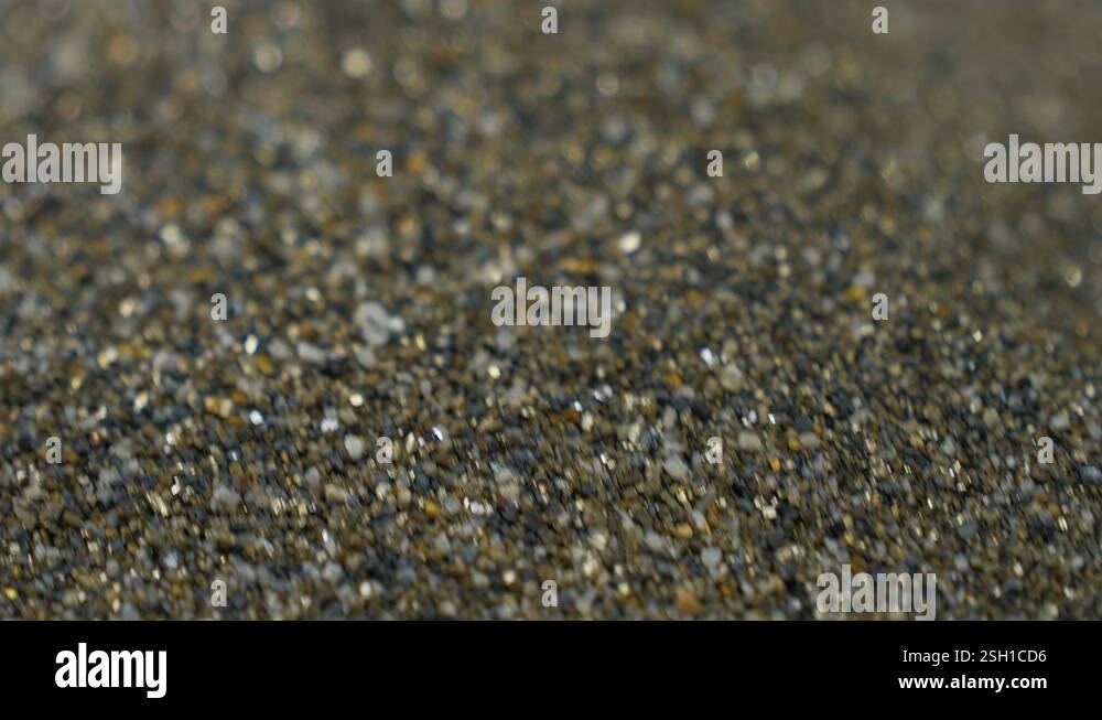 Looking through the gold dust pile to detect valuable ore material ...