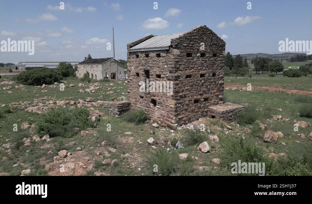 Rising aerial of historic Boer War blockhouse near highway in S Africa ...