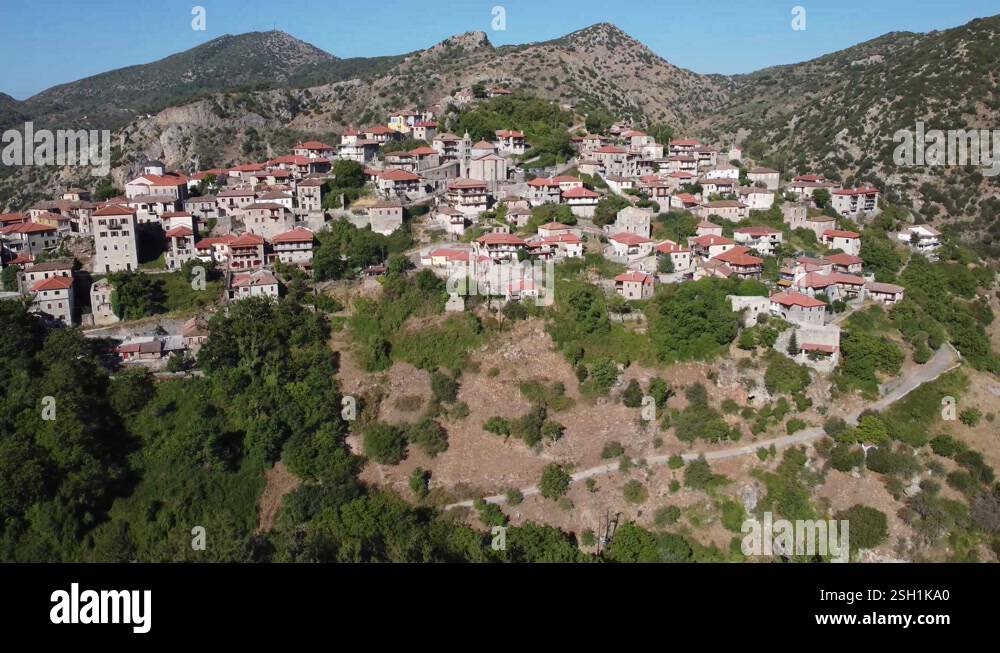Cinematic Tilt of Establishing Arcadia Village on the mountain. Greece ...