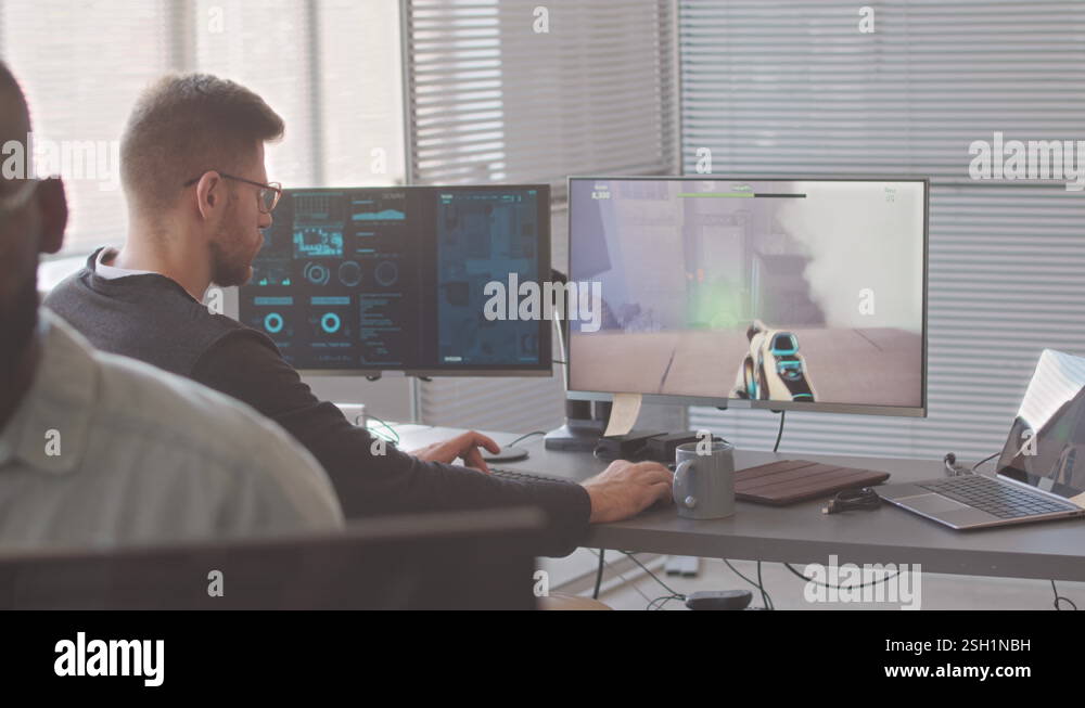 Video Game Developers Working in Office Stock Video Footage - Alamy