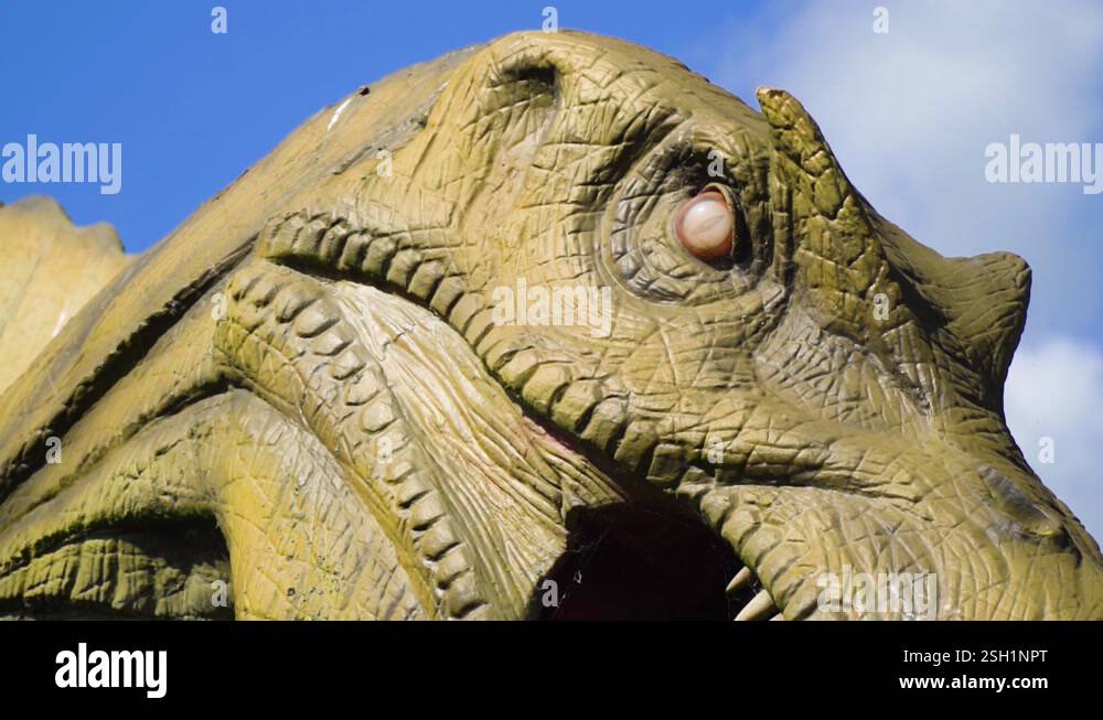 close up of eyes scary giant realistic model of dinosaur zooming out ...