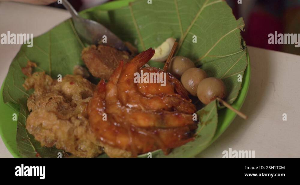 Nasi Jamblang or Jamblang rice with prawns, beef, tempeh and quail egg ...