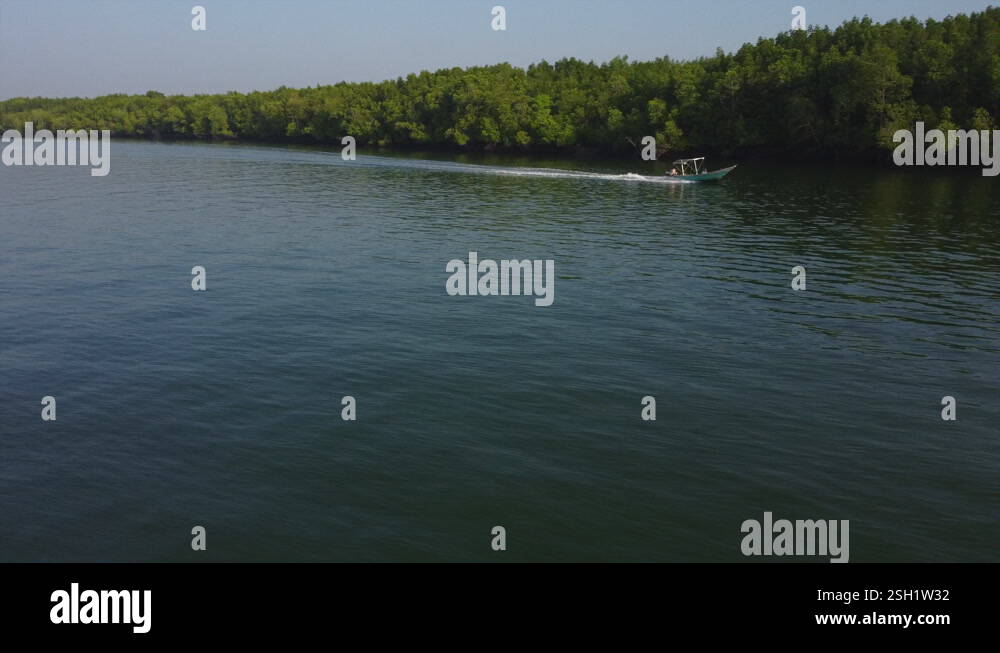 View of boat cruising on the Bagan Lalang river in the morning, sepang ...