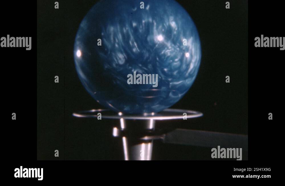 1960s: Bowling ball on scale, scale moves, pan across scale to weights ...