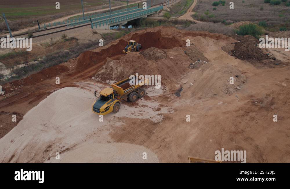 volvo wheel loaders + A30G articulated hauler moving sand - heavy Stock ...
