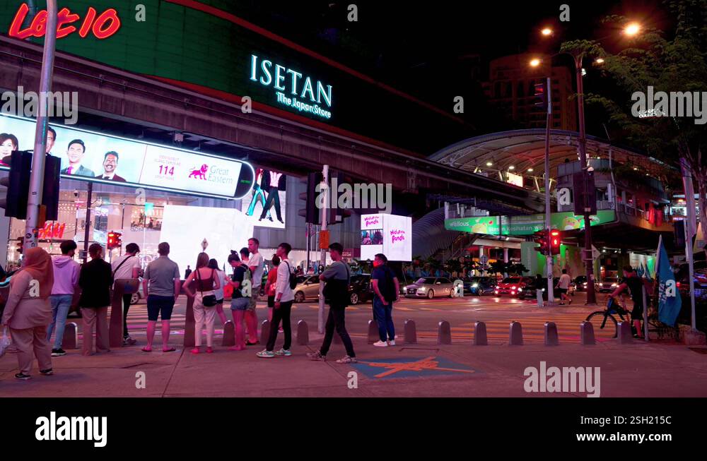 A night view of intersection in downtown of a modern Malaysian city ...