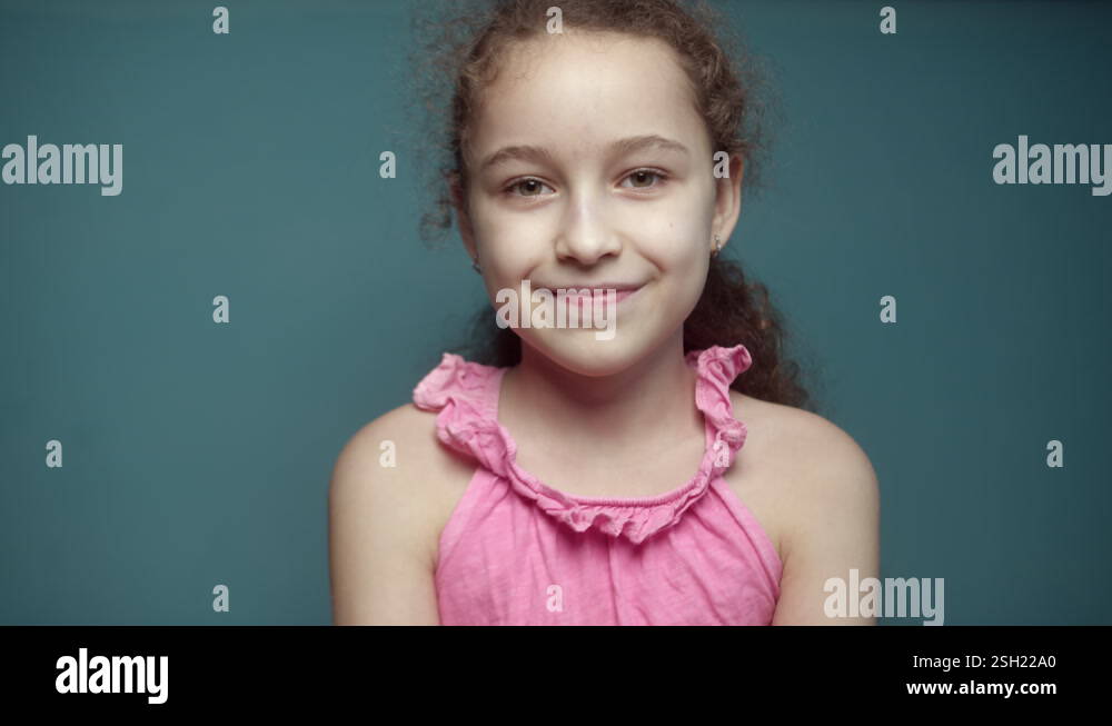 Portrait laughing child smiling, happy little girl looking at camera ...